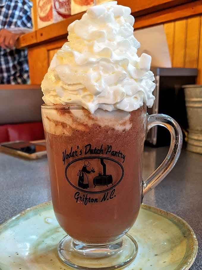 Hot chocolate piled high with whipped cream, because sometimes a drink deserves to be as dramatic as the occasion calls for.
