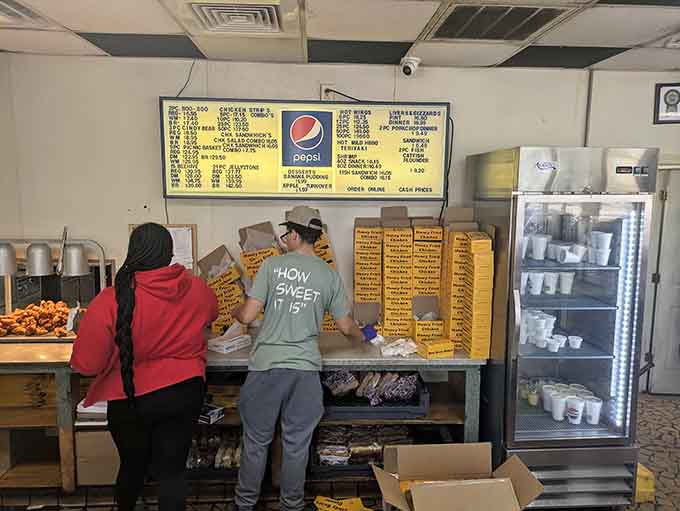 The team behind the counter keeps things moving with the kind of quiet efficiency that only comes from genuine pride.