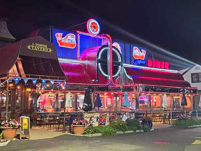 Neon lights blazing against the night sky turn this diner into a glowing promise of late-night comfort.