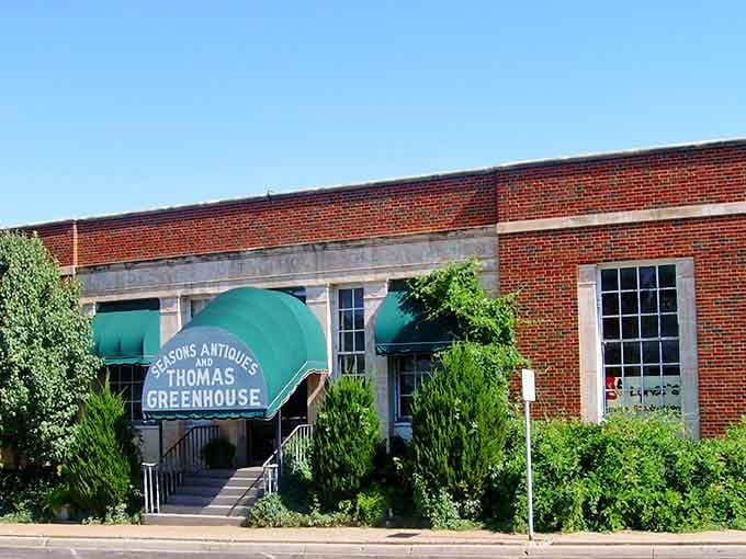 Seasons Antiques and Thomas Greenhouse share a tidy brick storefront, proof that good neighbors make great downtown blocks.