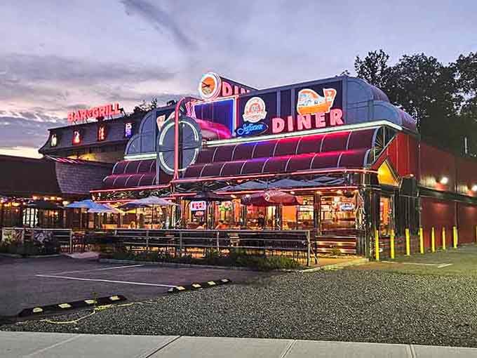 The retro curves and colorful signage create a nostalgic scene that looks like it belongs on a vintage postcard.