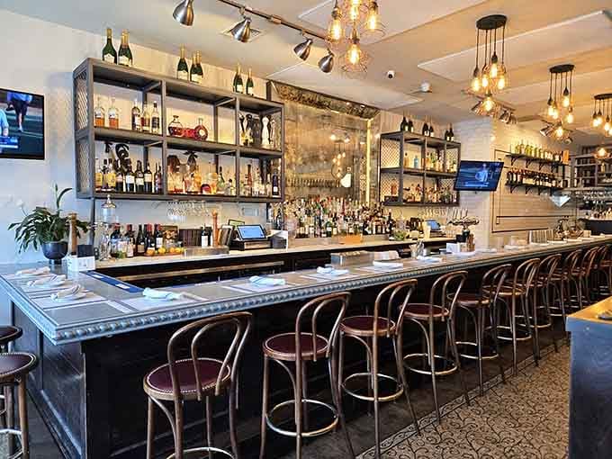 The gleaming bar lined with bentwood stools invites you to settle in for an aperitif and good conversation.