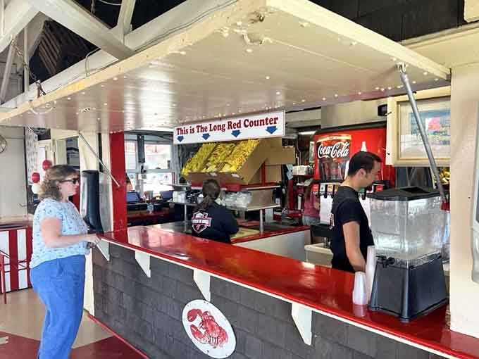 The Long Red Counter is where the magic officially begins, step up, place your order, and let the anticipation do its thing.
