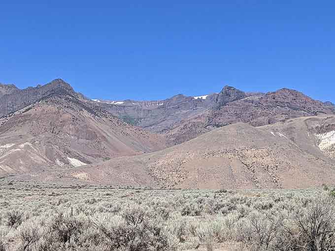 Steens Mountain wears its geological layers like badges of honor, each stripe telling million-year-old stories to patient listeners below.