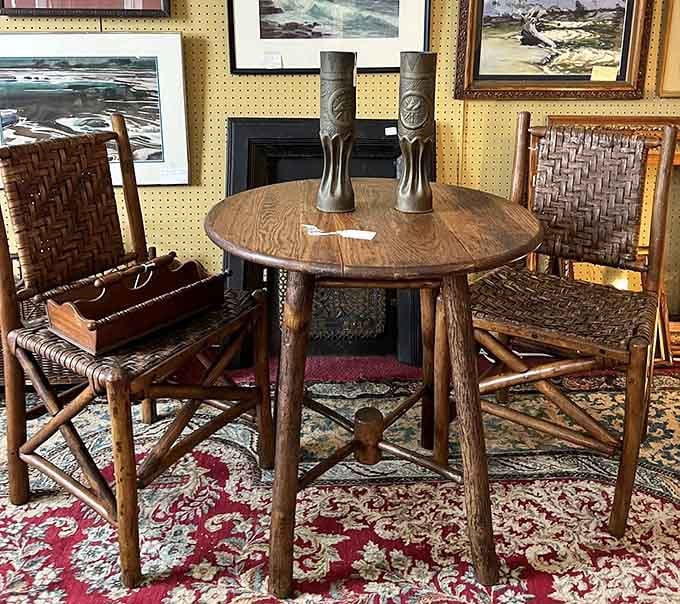 A rustic table and chairs so perfectly worn in, they look like they've already heard a thousand good stories.