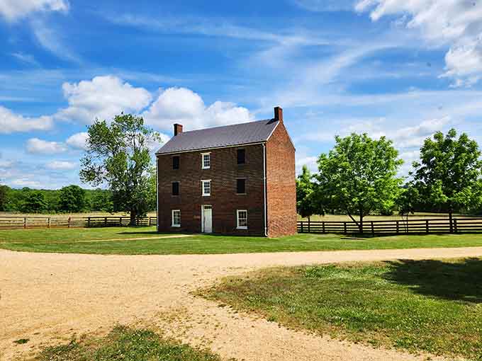 Three solid stories of Virginia brick standing tall, looking like it has absolutely no intention of apologizing for anything.