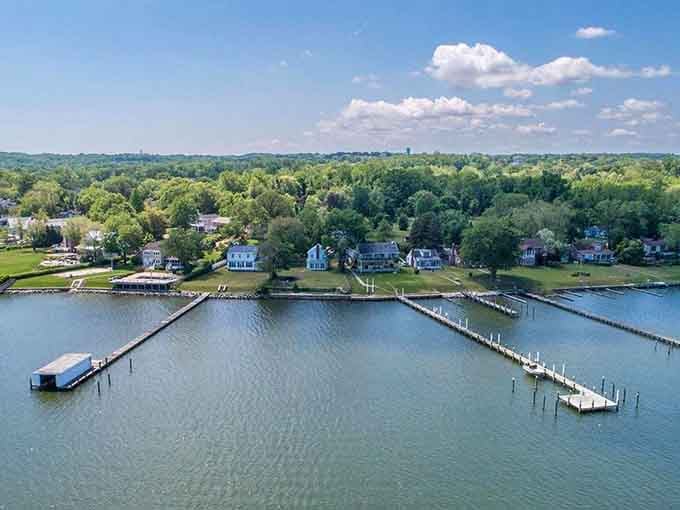 Private docks stretching into glassy water, lush green trees framing every roofline &mdash; waterfront living in Arnold looks suspiciously like a dream.