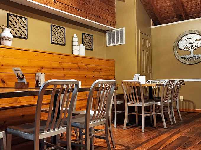 Knotty pine walls, hardwood floors, and a tree-of-life medallion. This dining room has more character than most people do.