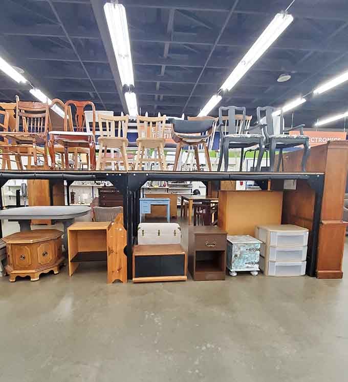 Chairs, side tables, and trunks lined up like furniture waiting patiently for its next chapter.