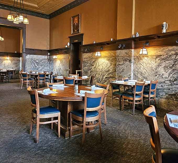 Marble walls, warm lighting, and portrait paintings overhead. Bender's dining room is the kind of room that makes you sit up straighter.