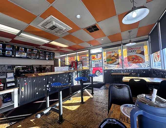 Orange ceiling tiles, blue tractor stools, and sunlight pouring through wide windows. Big Sky Burger's interior is cheerfully, unapologetically itself.
