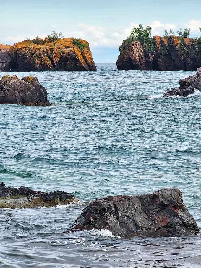 Lichen-covered rock islands rise from churning turquoise water like something straight out of a Viking saga.