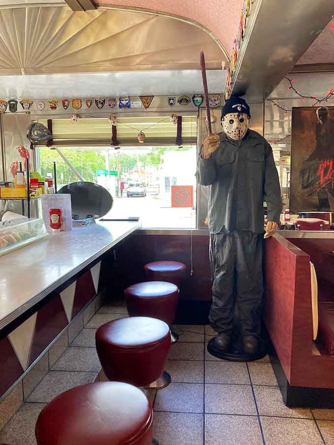 The full horror experience in one frame. Jason's watching, the booths are cozy, and the coffee's hot.