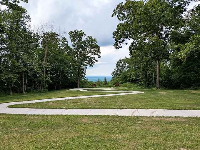 A winding path through open green space with a distant horizon peeking through. The park keeps surprising you.