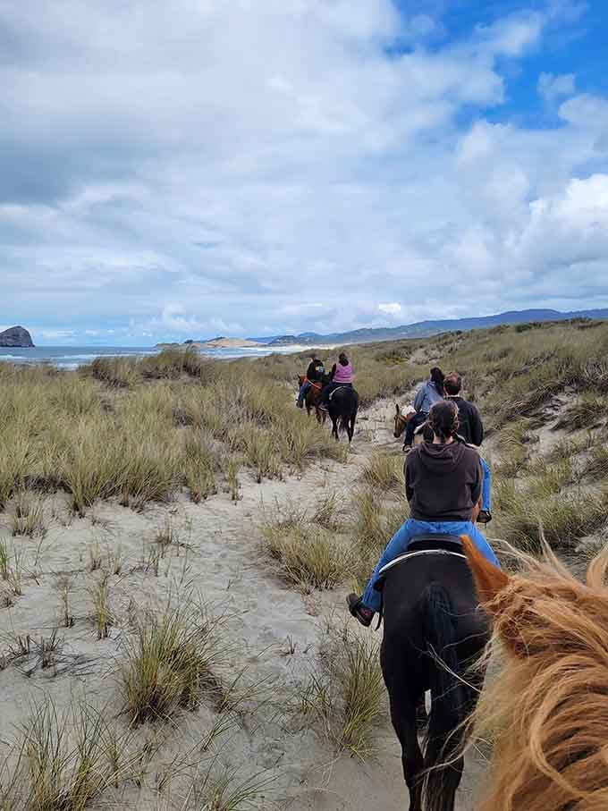 Riding through the dunes toward the ocean on horseback. This is the kind of thing you tell your grandkids about.