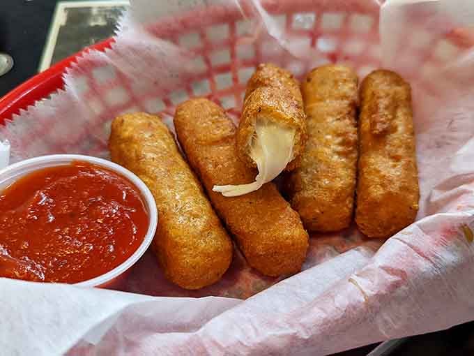 Mozzarella sticks achieve that perfect golden exterior while keeping the cheese pull game absolutely championship level.