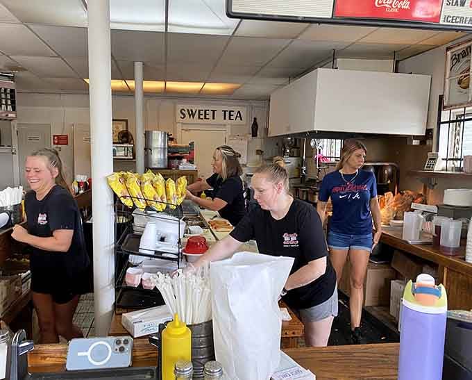 The crew behind the counter moving with the kind of easy confidence that only comes from doing something really well, really consistently.