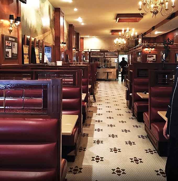 Row after row of deep red booths stretching toward the kitchen, this dining room has hosted more good conversations than most living rooms.