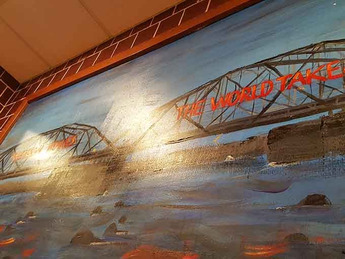 A painted bridge mural on the wall, a quiet nod to the community this diner proudly calls home.
