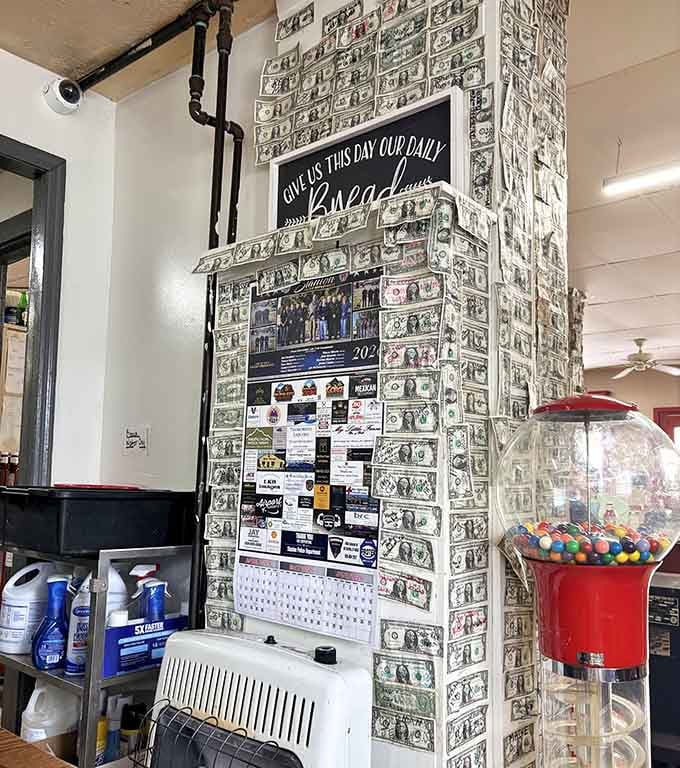 Dollar bills covering every inch of that pillar beneath a "Give Us This Day Our Daily Bread" sign &mdash; now that's a conversation starter.
