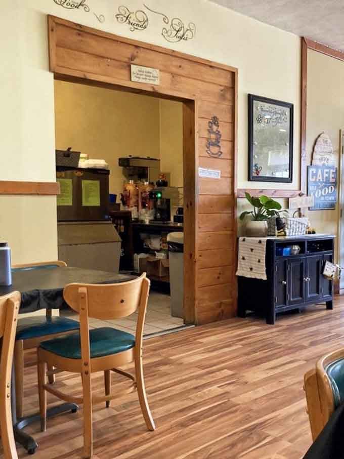 Warm wood trim, a glimpse into the kitchen, and a sign that says "Best Cafe in Town," hard to argue.