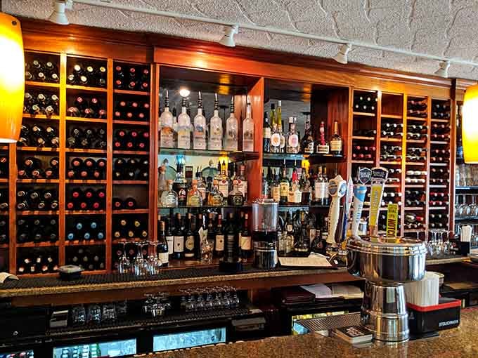 Floor-to-ceiling wine racks, a full back bar, and draft taps ready to go. Deciding what to drink here is a genuinely pleasant problem to have.