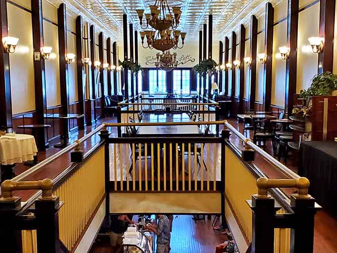 Cape Charles Coffee House glows with warm wood tones and chandelier light, the kind of interior that makes you want to linger over a second cup.