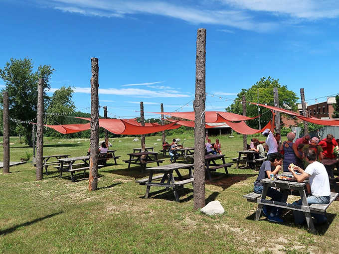 Sunny days transform this outdoor dining area into something magical, where strangers become temporary neighbors.