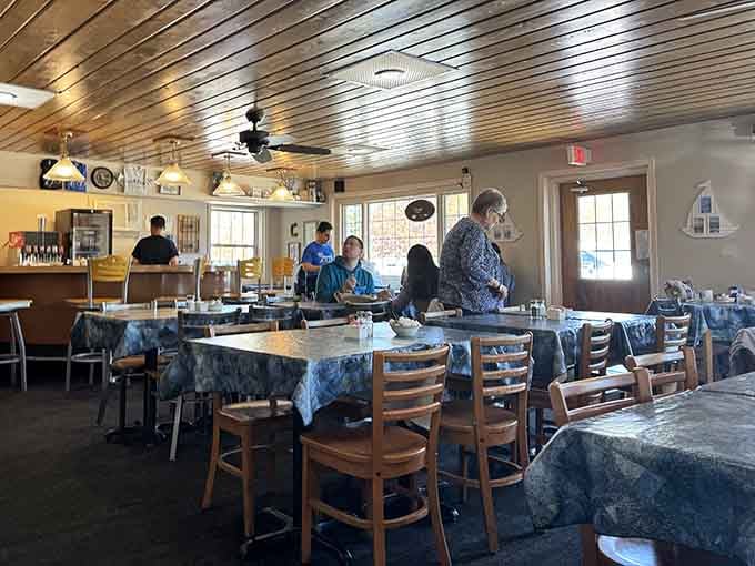The dining room buzzes with happy conversation and the clinking of forks against plates loaded with good food.
