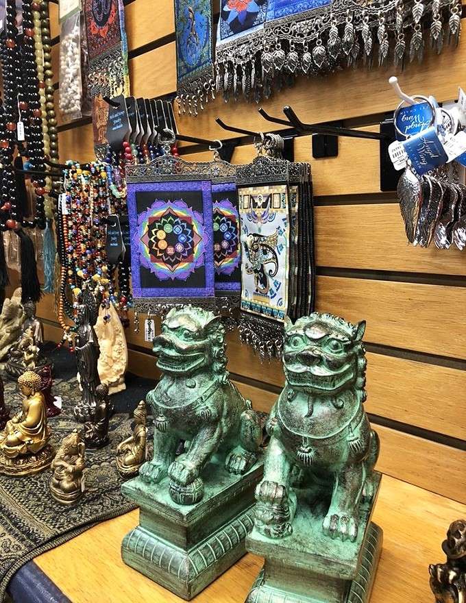 Guardian foo dogs keeping watch while beaded necklaces and mandala tapestries fill every corner with color.