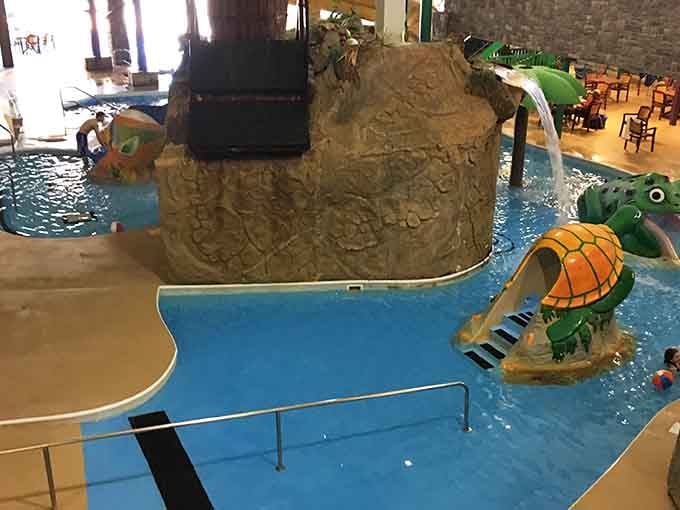 The turtle slide stands ready indoors, because the fun here doesn't stop when the sun does.