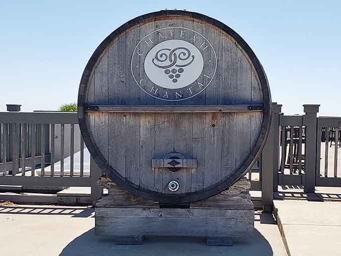 A weathered barrel bearing the Chateau Chantal logo, standing guard on the terrace like a very distinguished bouncer.