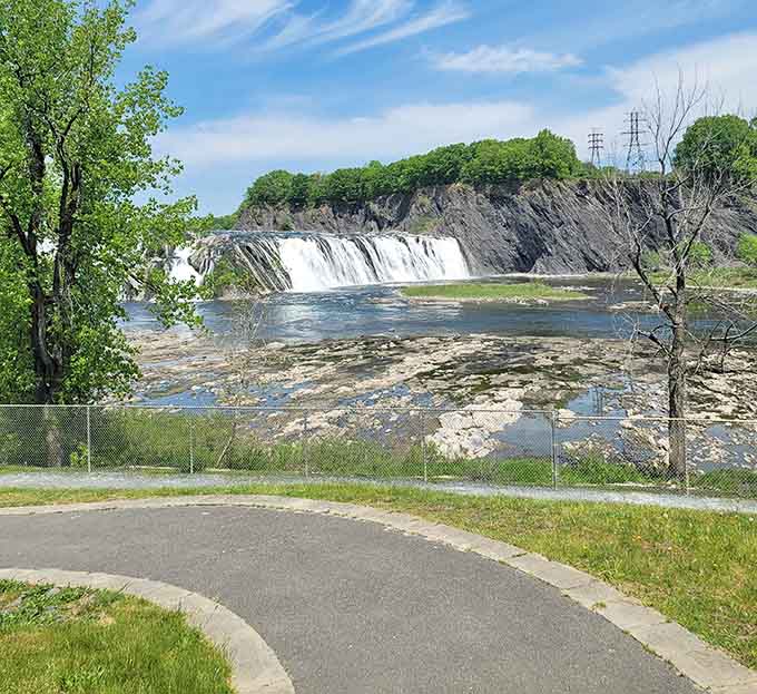 The riverside perspective reveals layers of rock that have been here longer than human memory can reach.