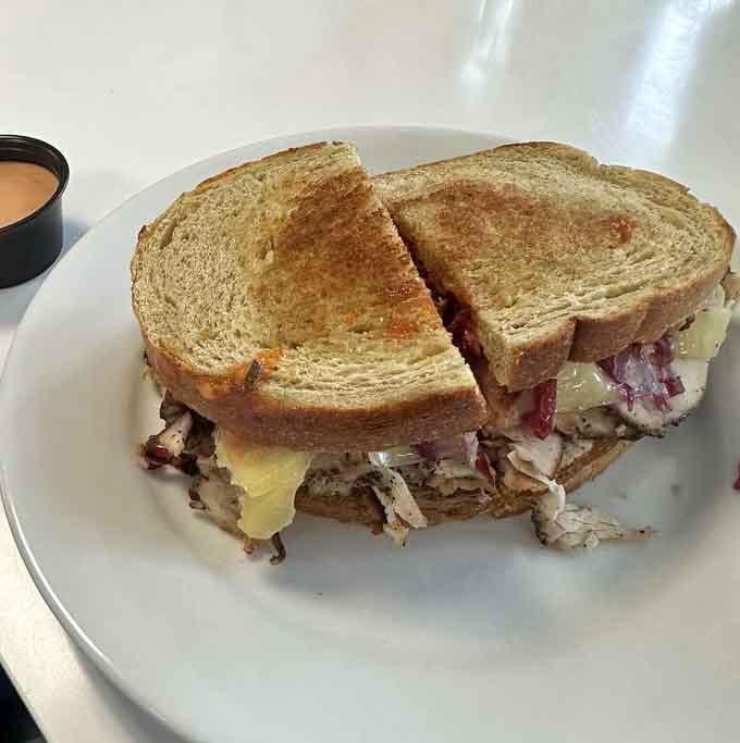 The turkey Reuben on rye, proving that breakfast sandwiches can have sophisticated flavor profiles without being pretentious about it.
