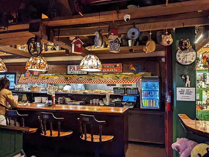 Counter seating surrounded by farm collectibles and warm lighting, cozy enough to make you forget your to-do list.
