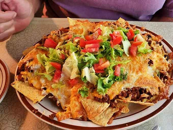 Nachos piled high with seasoned beef, melted cheese, fresh tomatoes, and lettuce. Crandall's doesn't do anything halfway.