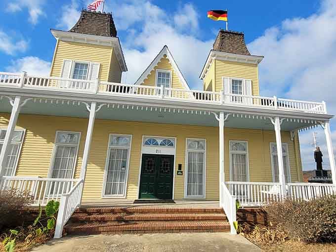 That cheerful yellow Victorian facade with dual flags welcomes history buffs to explore stories from generations past beautifully preserved.