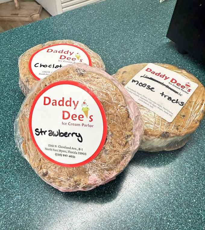 Strawberry, Chocolate Chip, and Moose Tracks labeled by hand &mdash; these ice cream cakes are homemade charm wrapped in plastic.