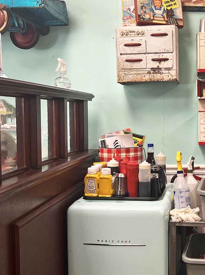 Vintage finds, a retro Magic Chef fridge, and condiments lined up like soldiers ready for breakfast duty.