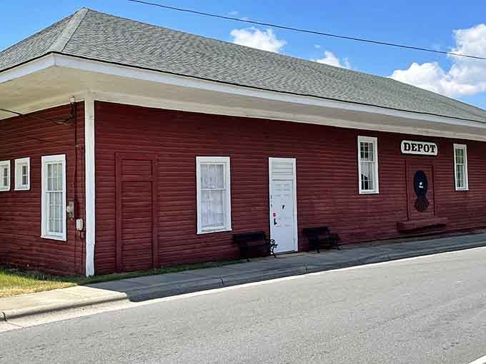 That classic red depot building with its crisp white trim is Davidson's quiet nod to the railroad history that helped shape this charming town.