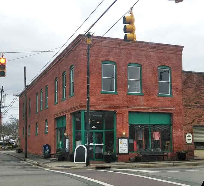 A corner brick building with green trim that proves downtown Eden still has plenty of personality left.