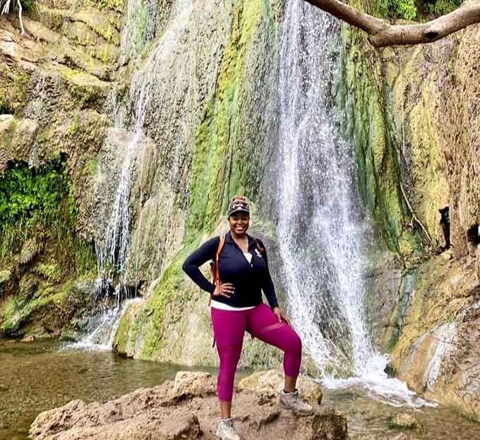Standing triumphant at the base of the falls, this hiker absolutely nailed the whole adventure thing.