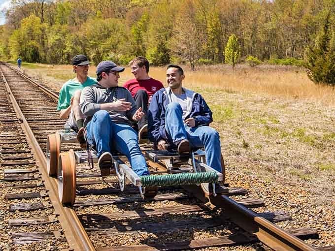 Four guys, one rail bike, zero complaints. This is what a genuinely good day looks like.