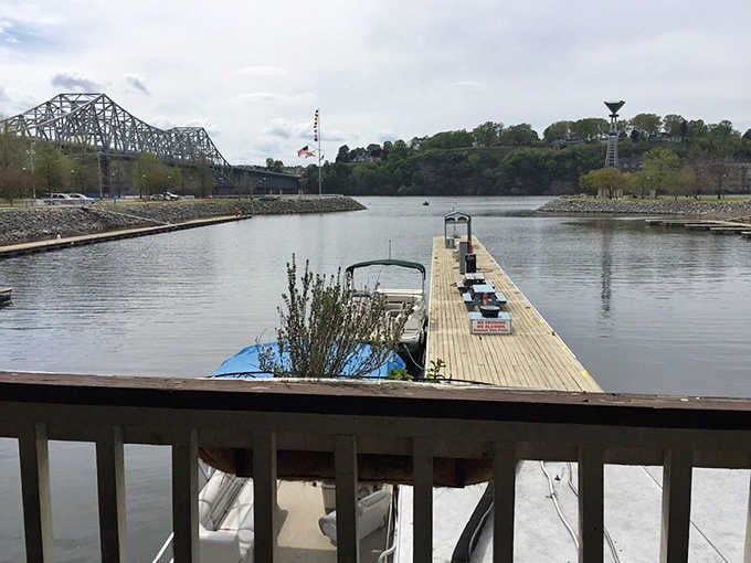 Boats docked along the Tennessee River, with the O'Neal Bridge standing watch. Florence's waterfront is genuinely hard to leave.