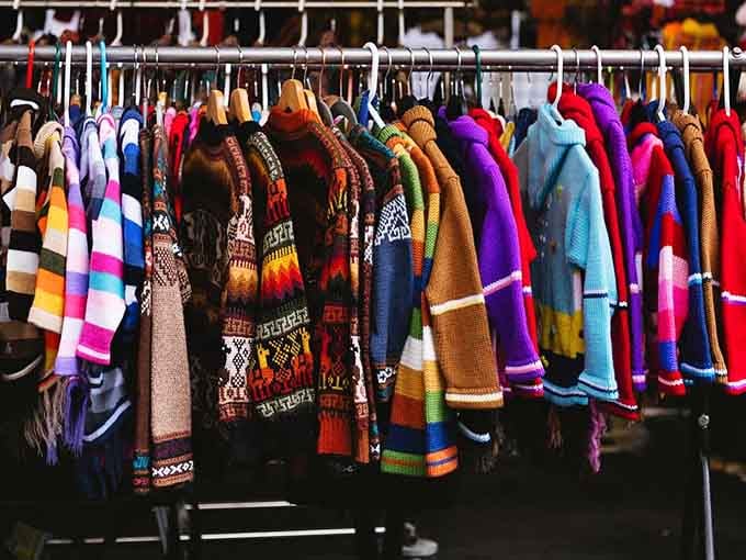 A rack of hand-knit wool sweaters so colorful they could brighten even the greyest Seattle Sunday morning.