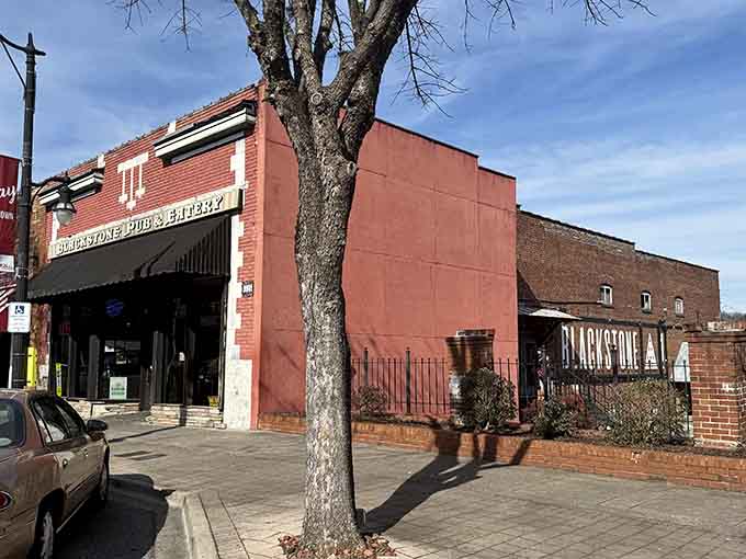 Blackstone Pub and Eatery's bold red brick corner presence feels like the kind of neighborhood spot every good town deserves to have.