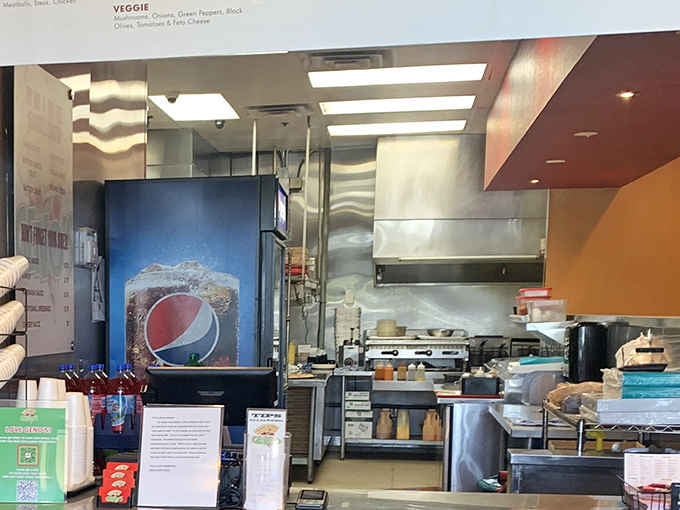Through the glass, you can see exactly where the magic happens. No mystery, just honest, straightforward, delicious pizza making.