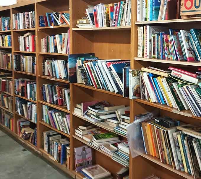Shelves packed with books waiting for their next reader, because some stories deserve physical pages.