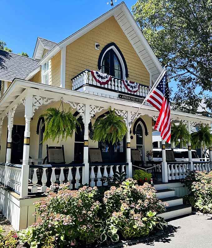 The Admiral's Quarters cottage stands proud with hanging ferns and patriotic bunting. Reporting for summer duty.