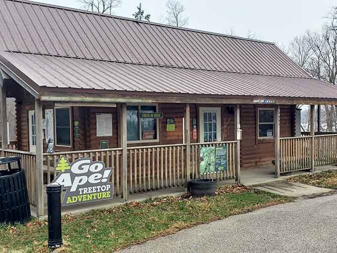 The rustic log cabin check-in station is where your ordinary Saturday quietly transforms into something worth bragging about.